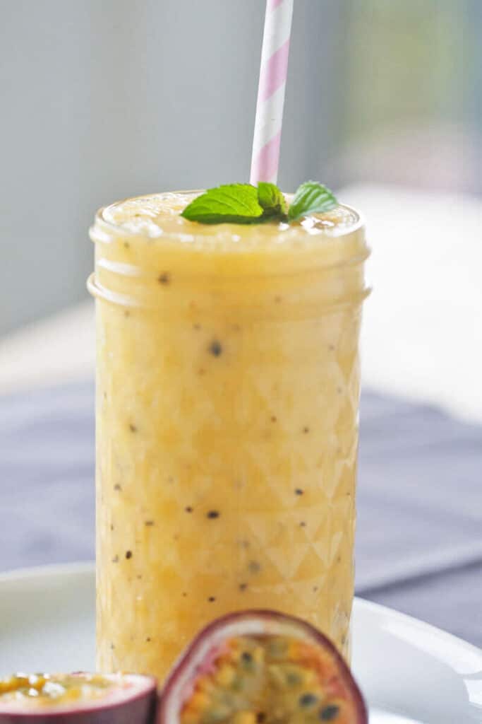 Mango & Passion Fruit Tropical Smoothie - Vibrant plate Mango & Passion Fruit Tropical Smoothie - Vibrant plate