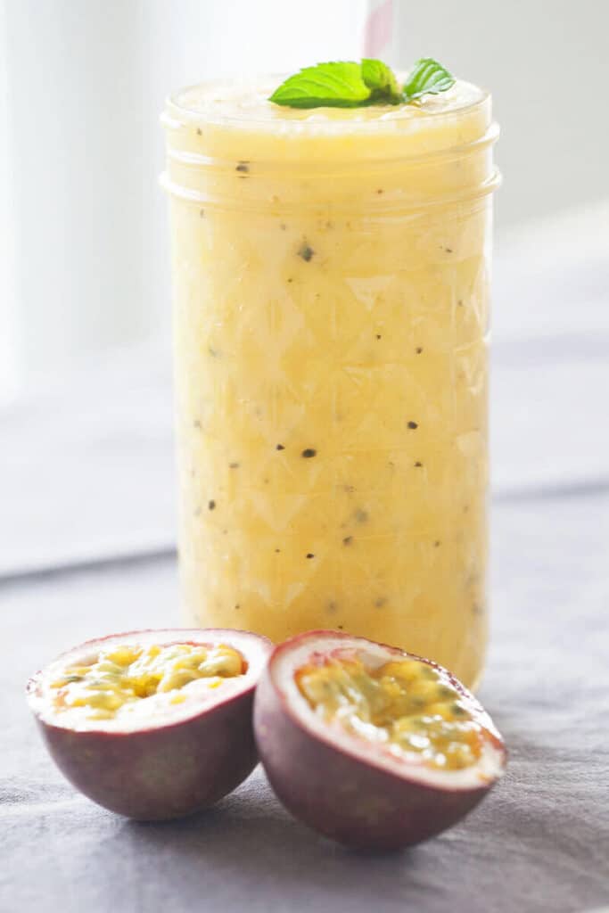 Mango & Passion Fruit Tropical Smoothie - Vibrant plate Mango & Passion Fruit Tropical Smoothie - Vibrant plate