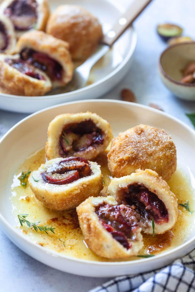 Cinnamon Plum Dumplings with Butter Breadcrumbs - Vibrant plate