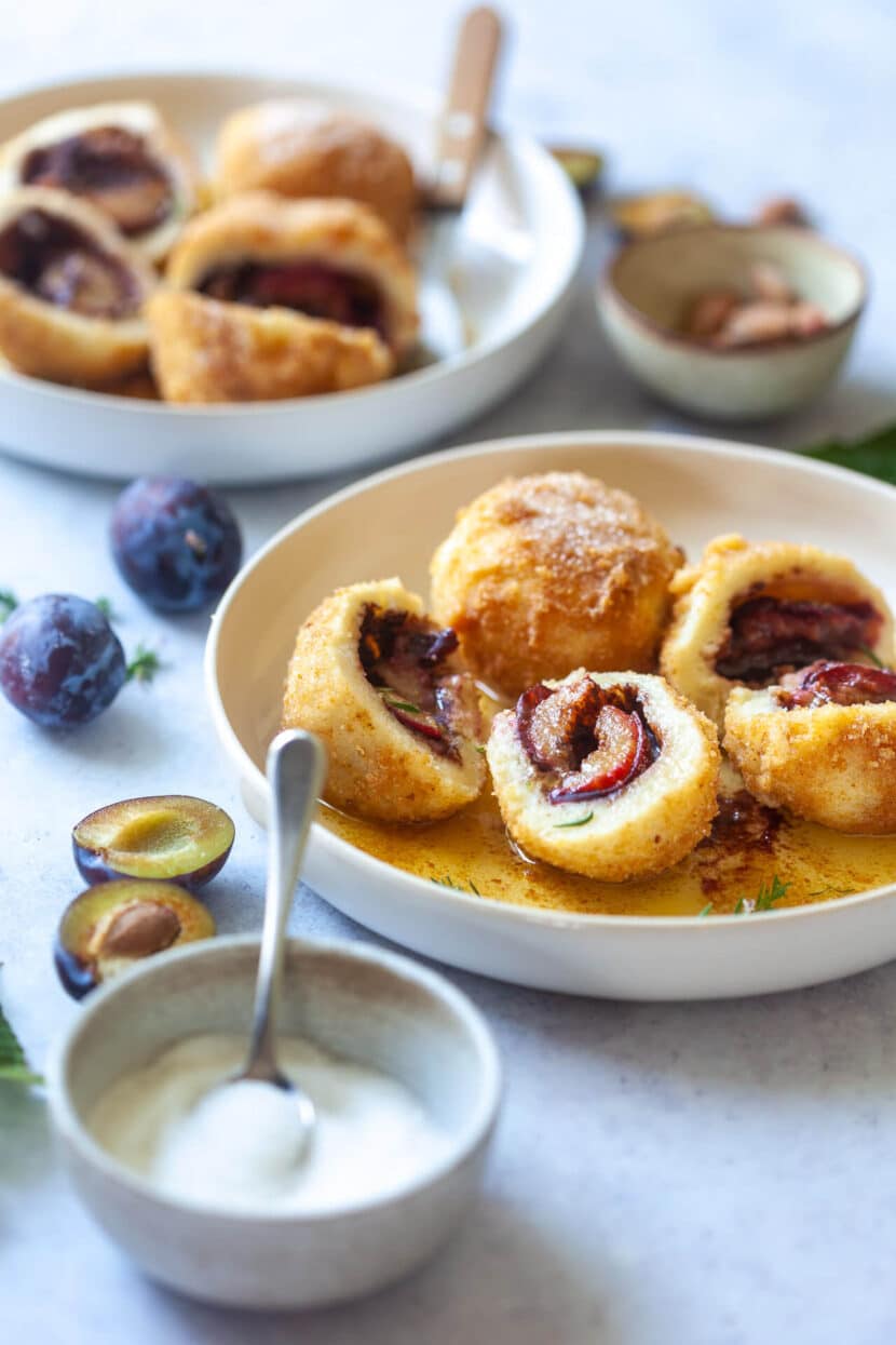 Cinnamon Plum Dumplings with Butter Breadcrumbs - Vibrant plate